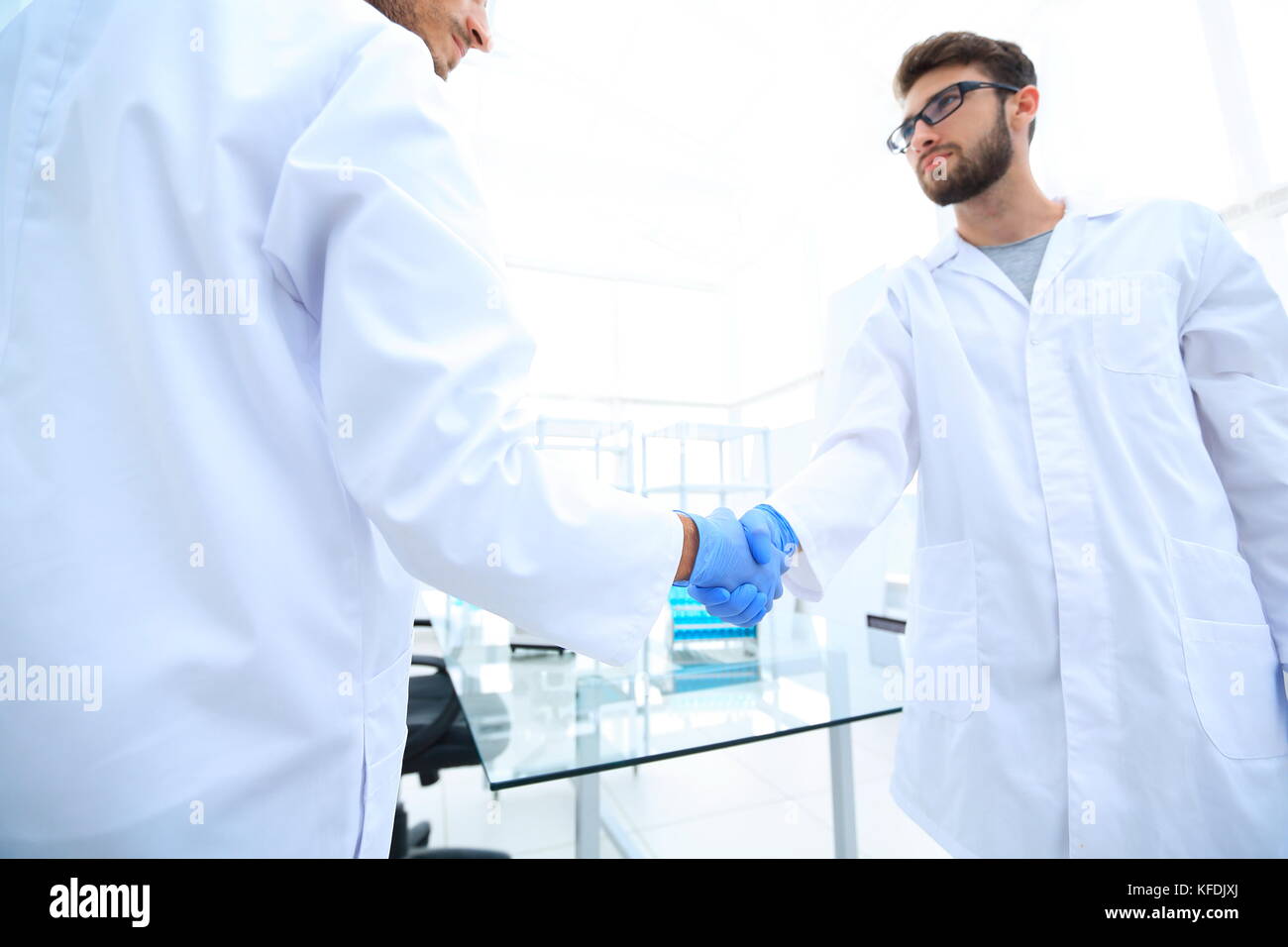 medical workers make handshake Stock Photo - Alamy