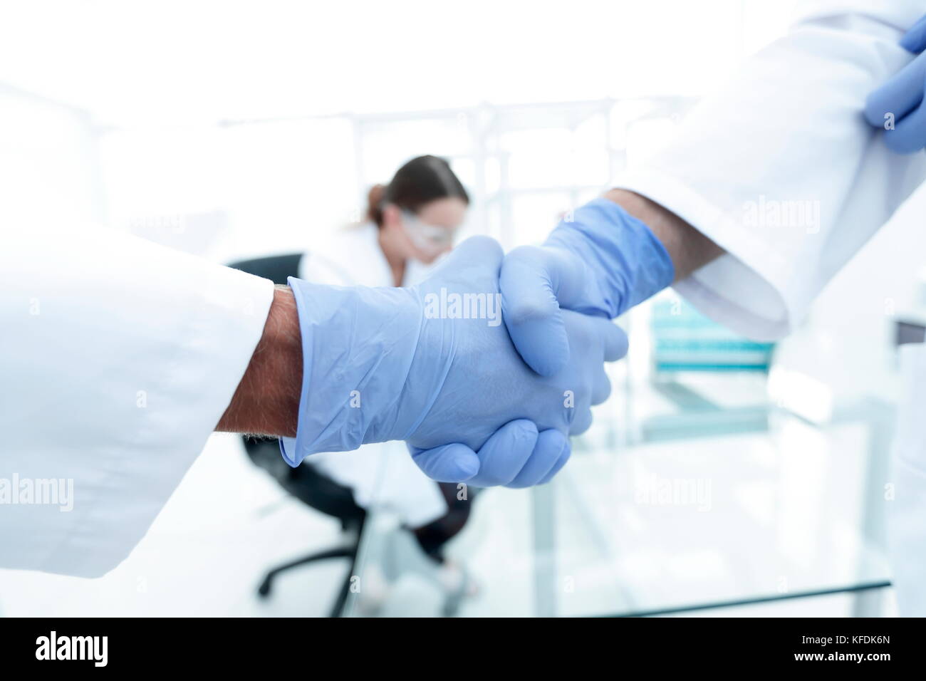 medical workers make handshake Stock Photo - Alamy