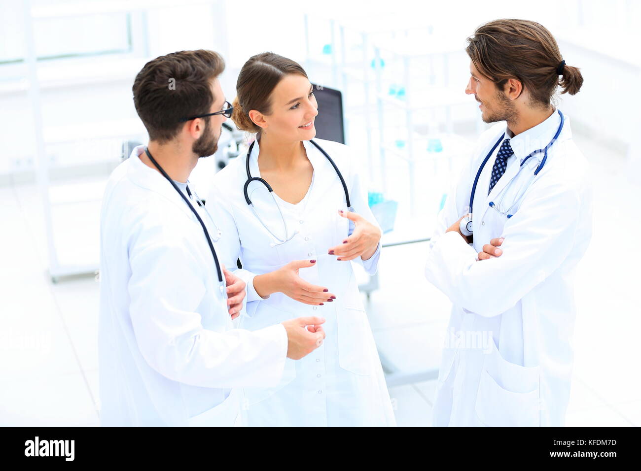 Team of doctors working together on patients file at hospital Stock ...