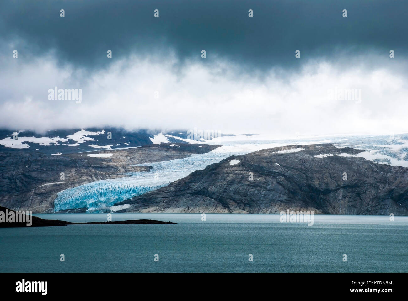 Glacier In Norway With Ice And Snow. Mountain With Lake And Clouds ...