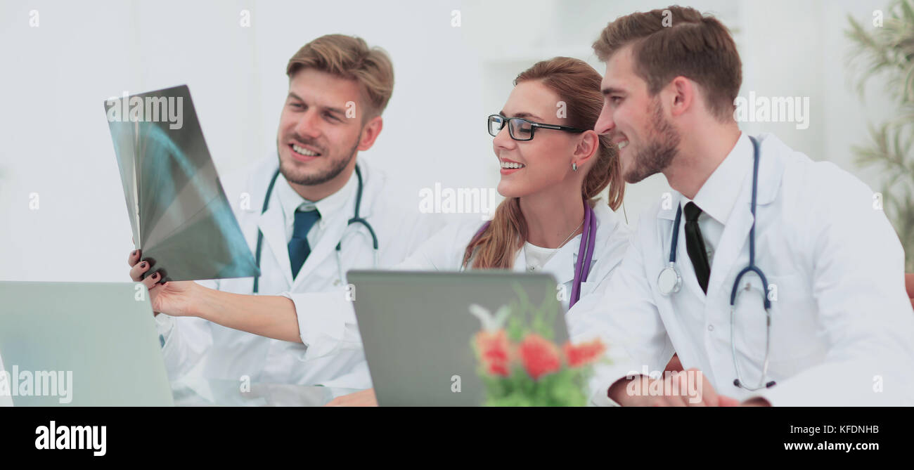 Team of medical professionals working at the medical office Stock Photo ...