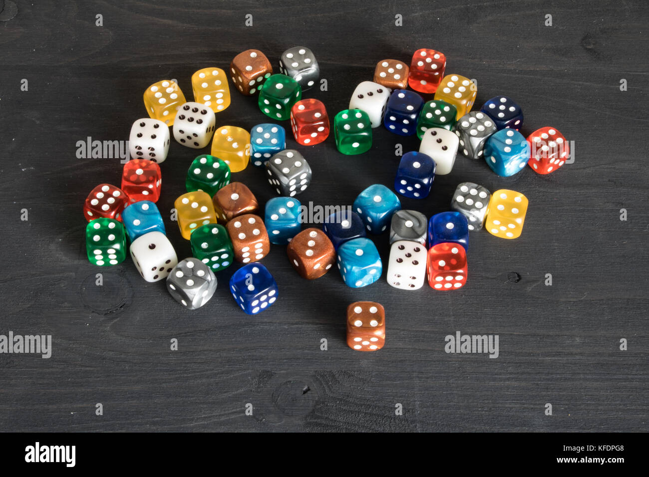 Several Colored Dice on Dark Stained Wood Stock Photo - Alamy