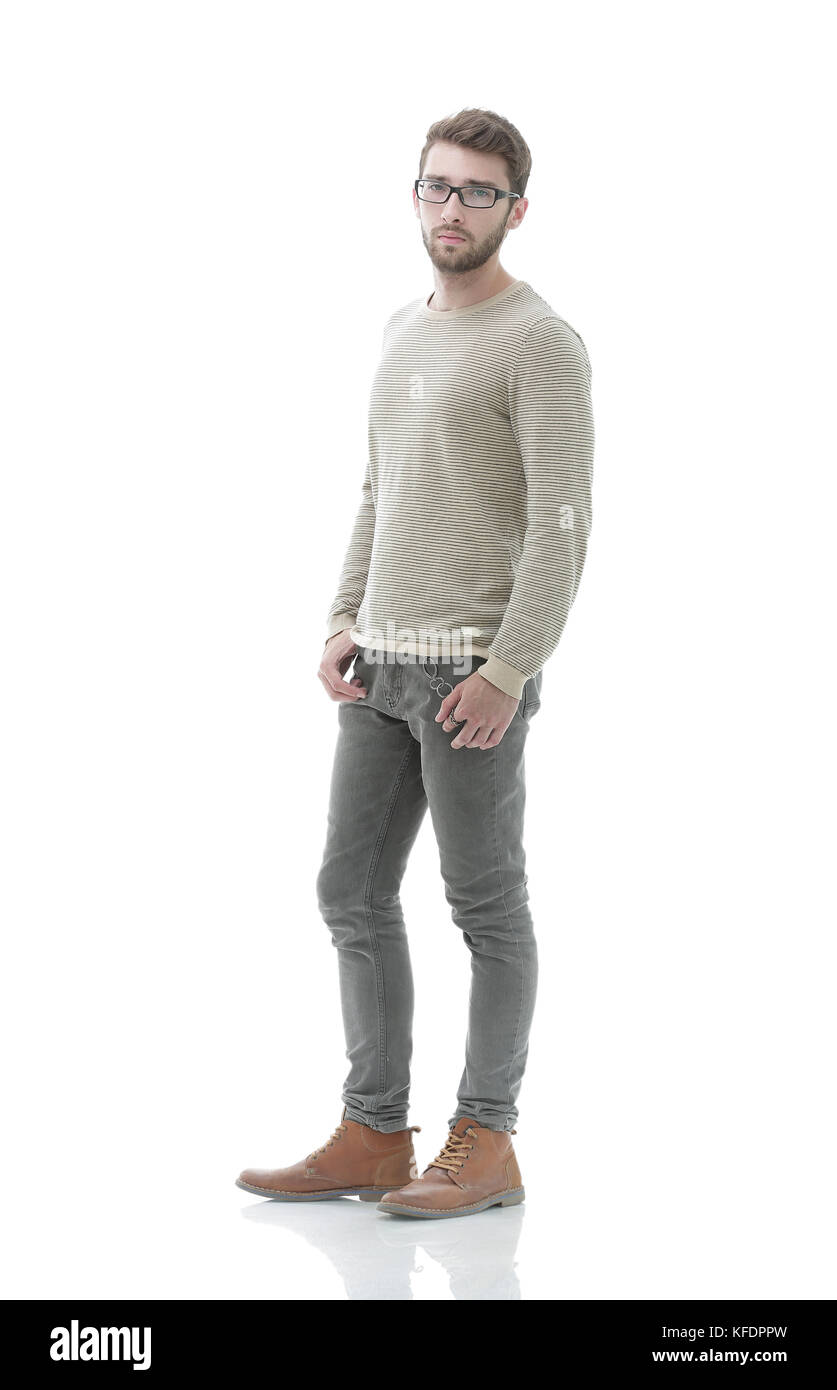 side view Full length of confident young man holding hands in pockets ...