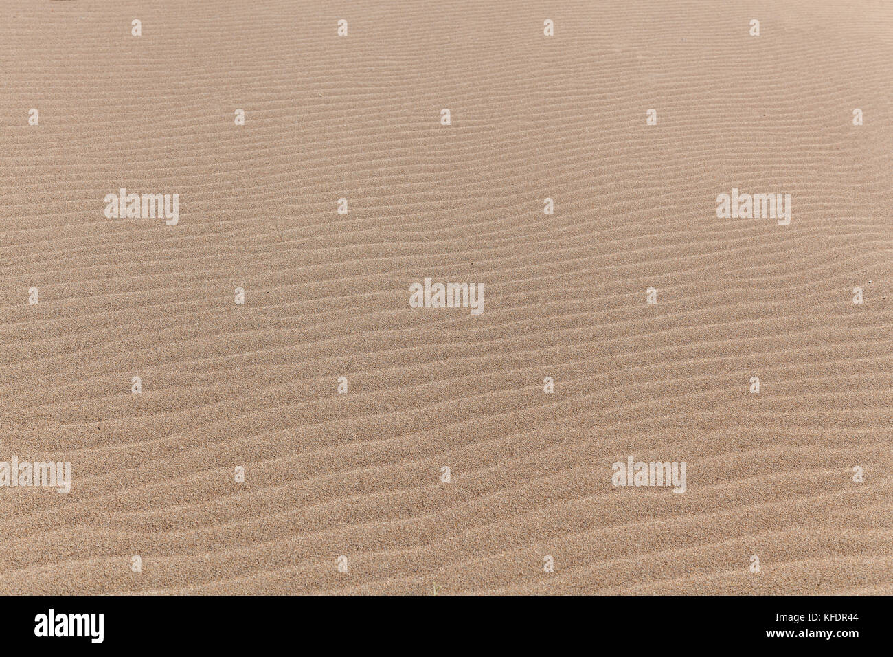 Yellow sand texture for background Stock Photo - Alamy