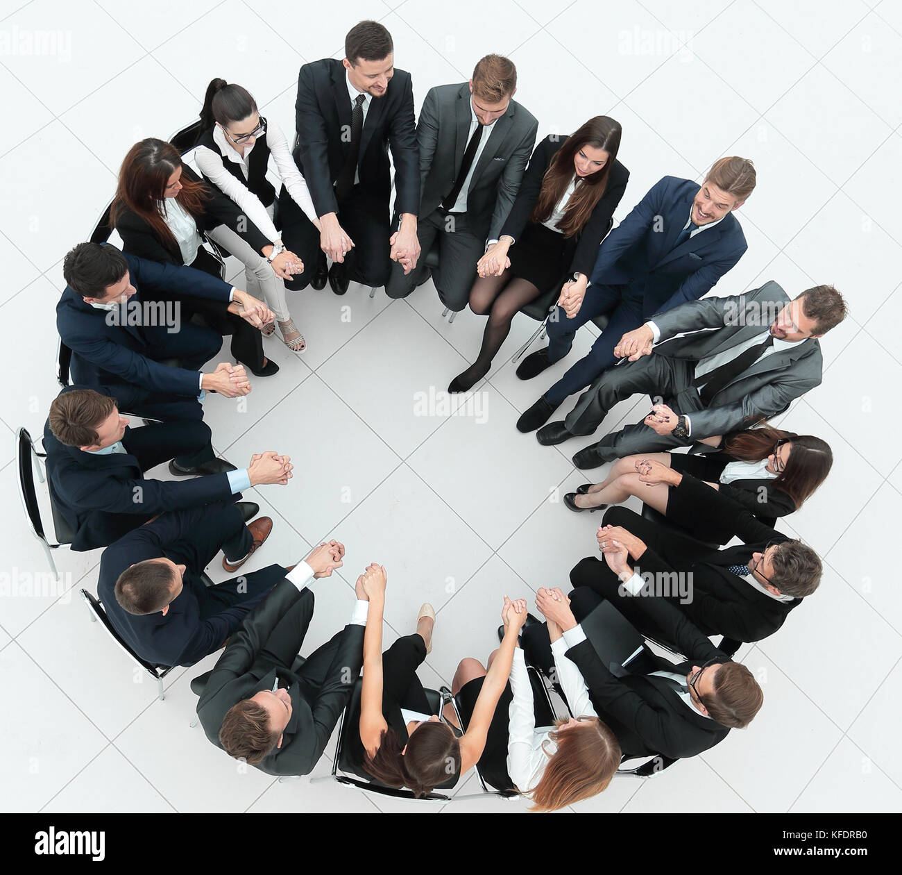 concept of team building.large business team sitting in a circle and ...