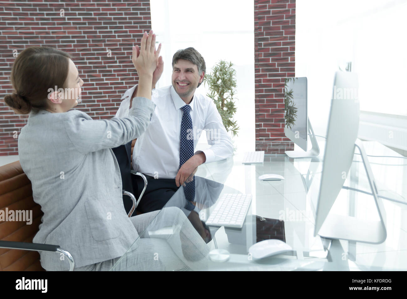 Concept of victory. Colleagues "makes five" as a sign of success Stock ...