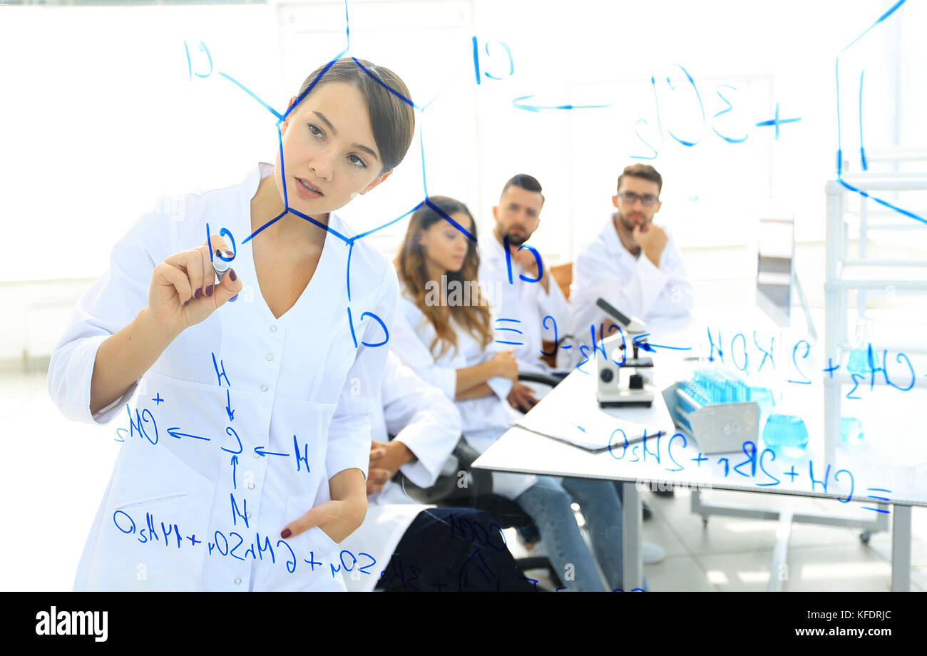 view through the transparent Board. female scientist makes a report to ...