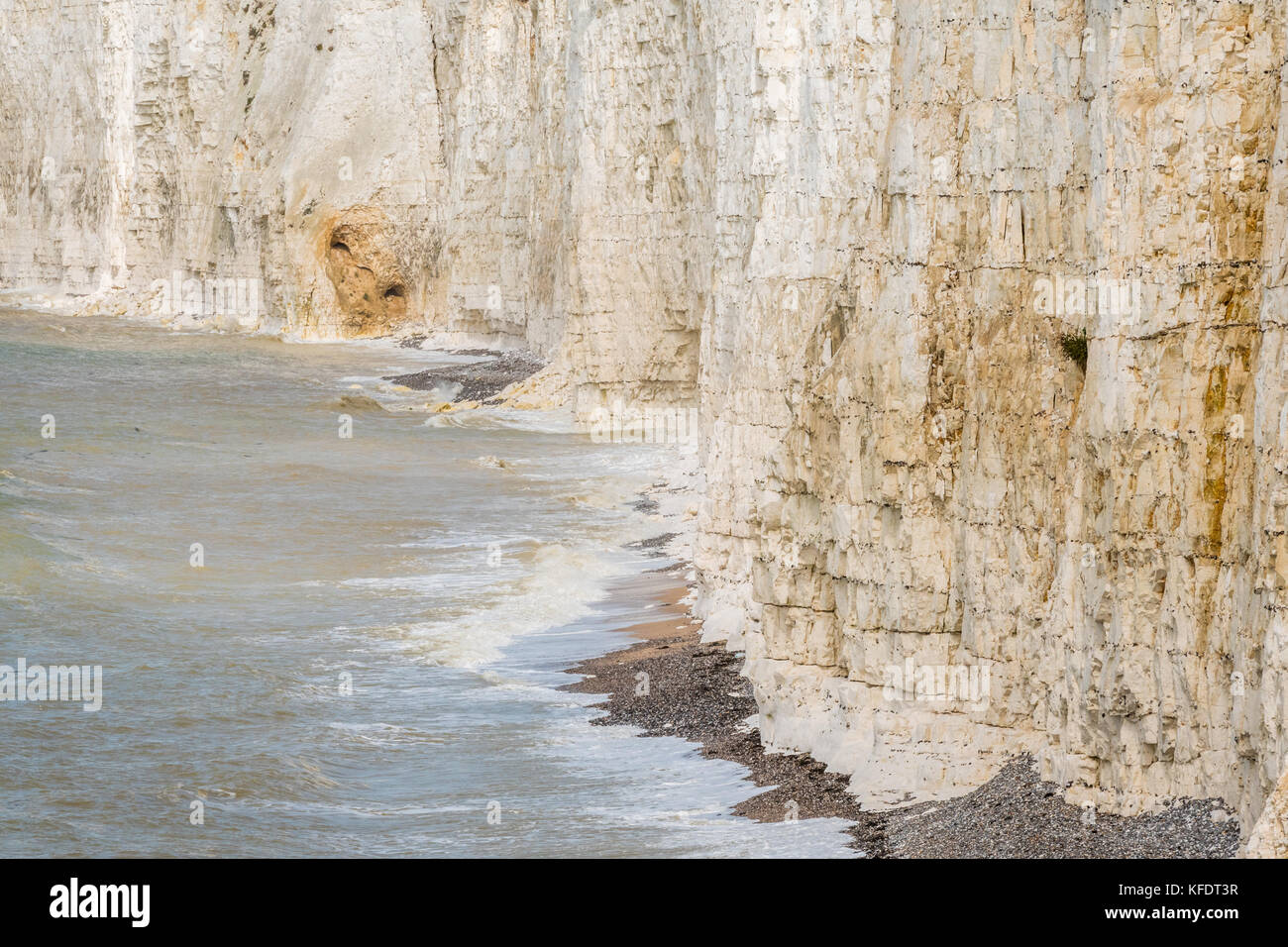 The English Channel laps at the foot of the white chalk seven sisters ...