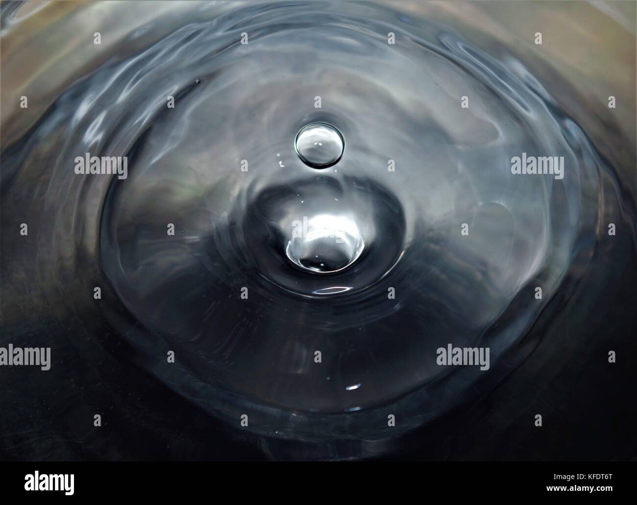 Droplets and ripples of various shapes and colours Stock Photo - Alamy