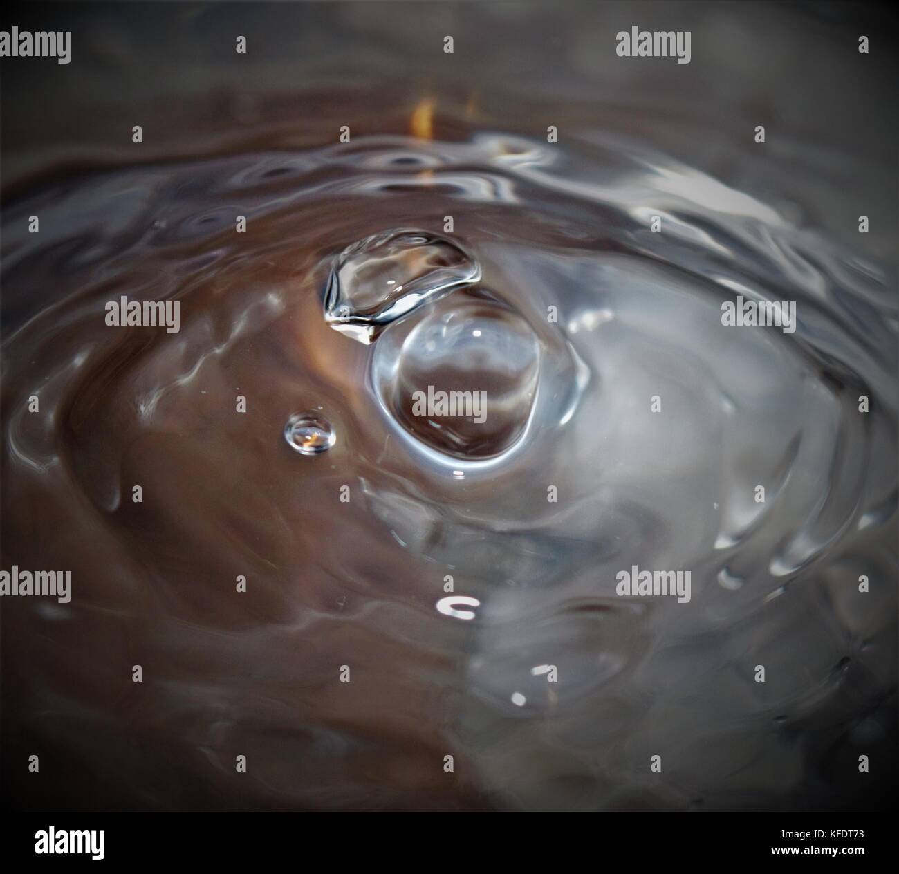 Droplets and ripples of various shapes and colours Stock Photo - Alamy