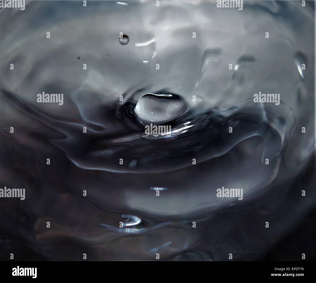 Droplets and ripples of various shapes and colours Stock Photo - Alamy