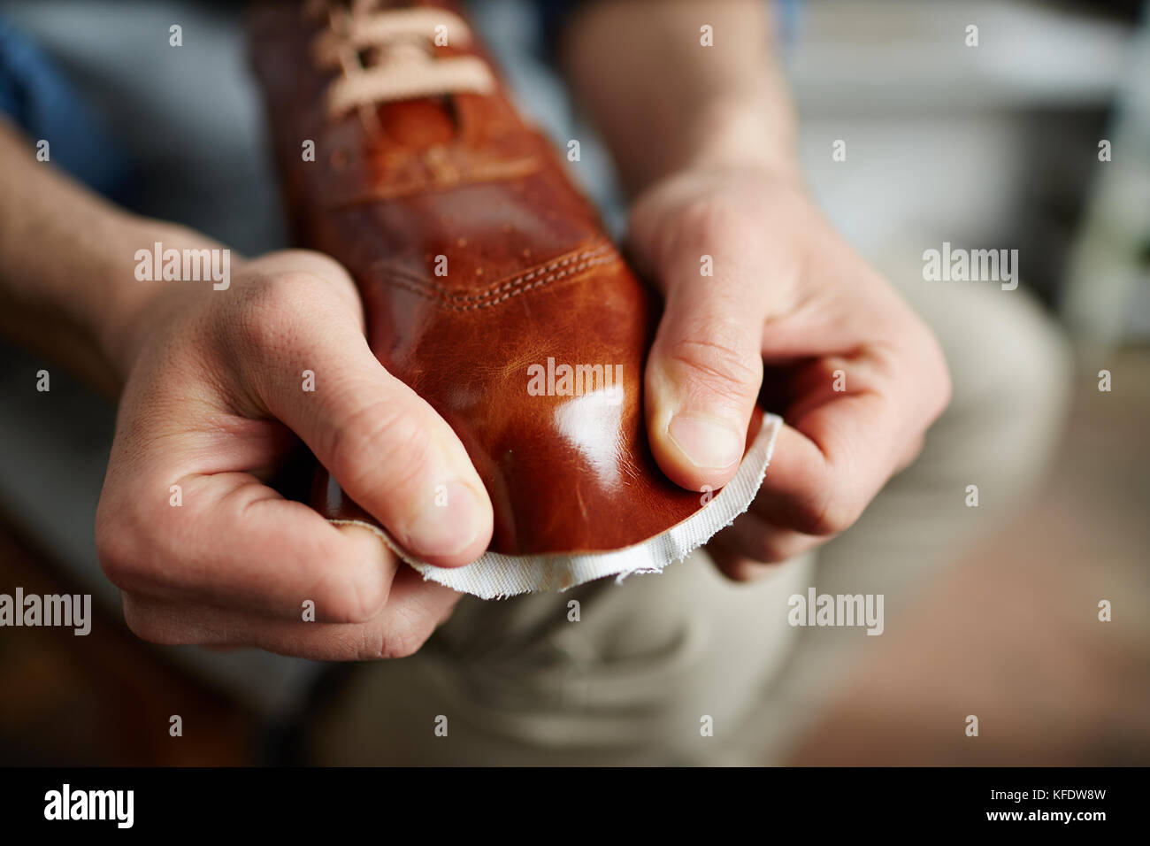 Modern cobbler stretching new leather all over boot model Stock Photo ...