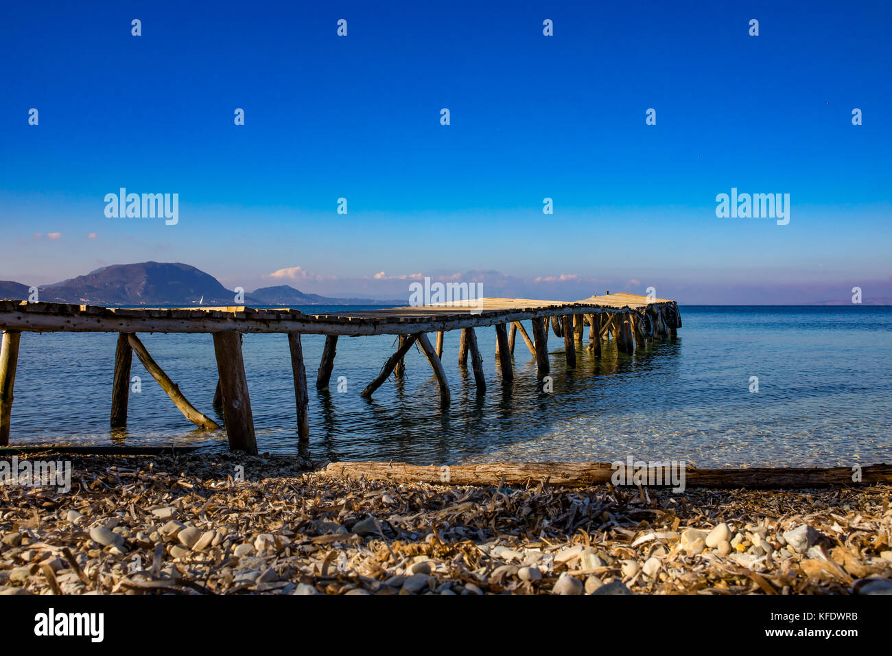 Wooden jetty or a pier on the Ionian Sea - a part of Mediterranean Sea ...