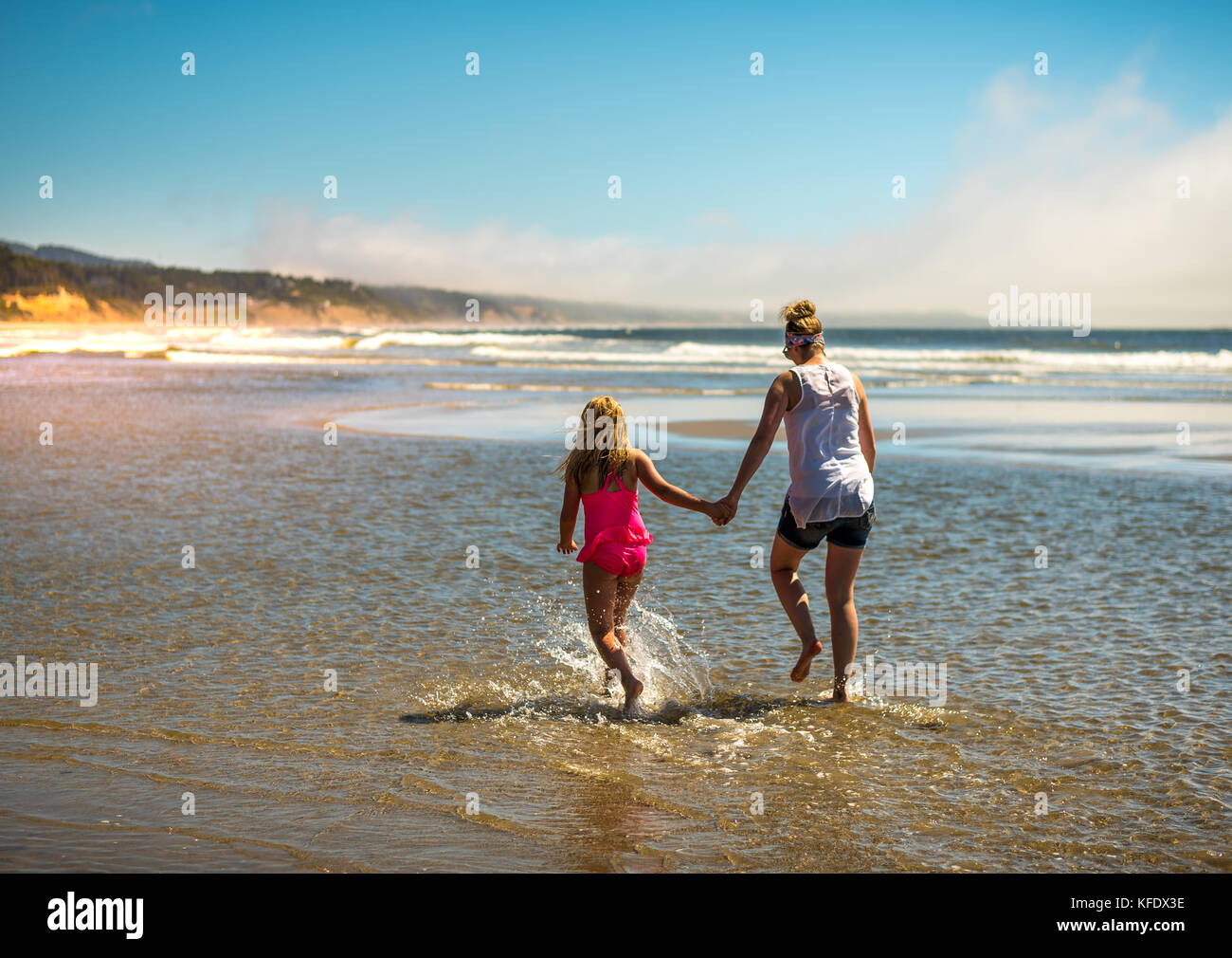 Running child to the waves hi-res stock photography and images - Alamy