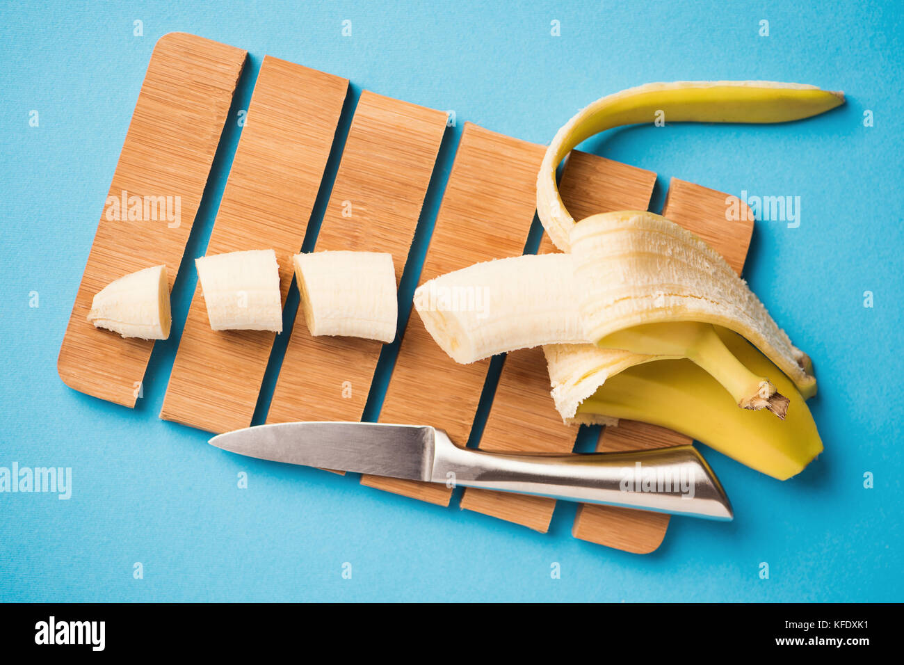 Banana Cut on Chopping Board Stock Photo - Alamy