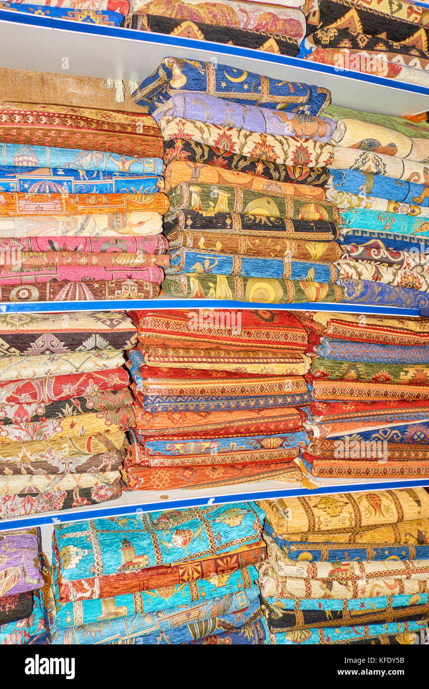 Stacks of colorful handmade pure wool rugs in tourist stall of Old ...