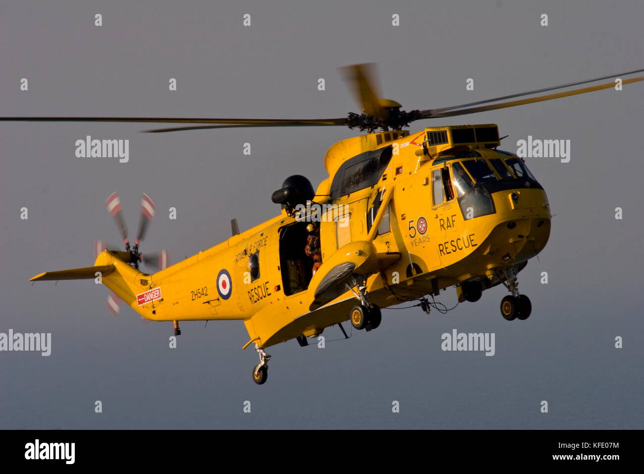 Yellow Sea King Helicopter flying off Baggy Point Croyde Devon Stock ...