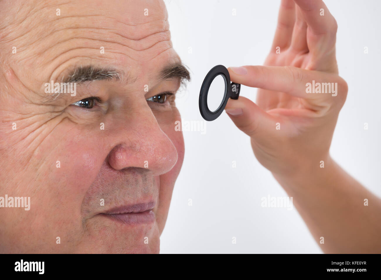 Old man eye test hi-res stock photography and images - Alamy