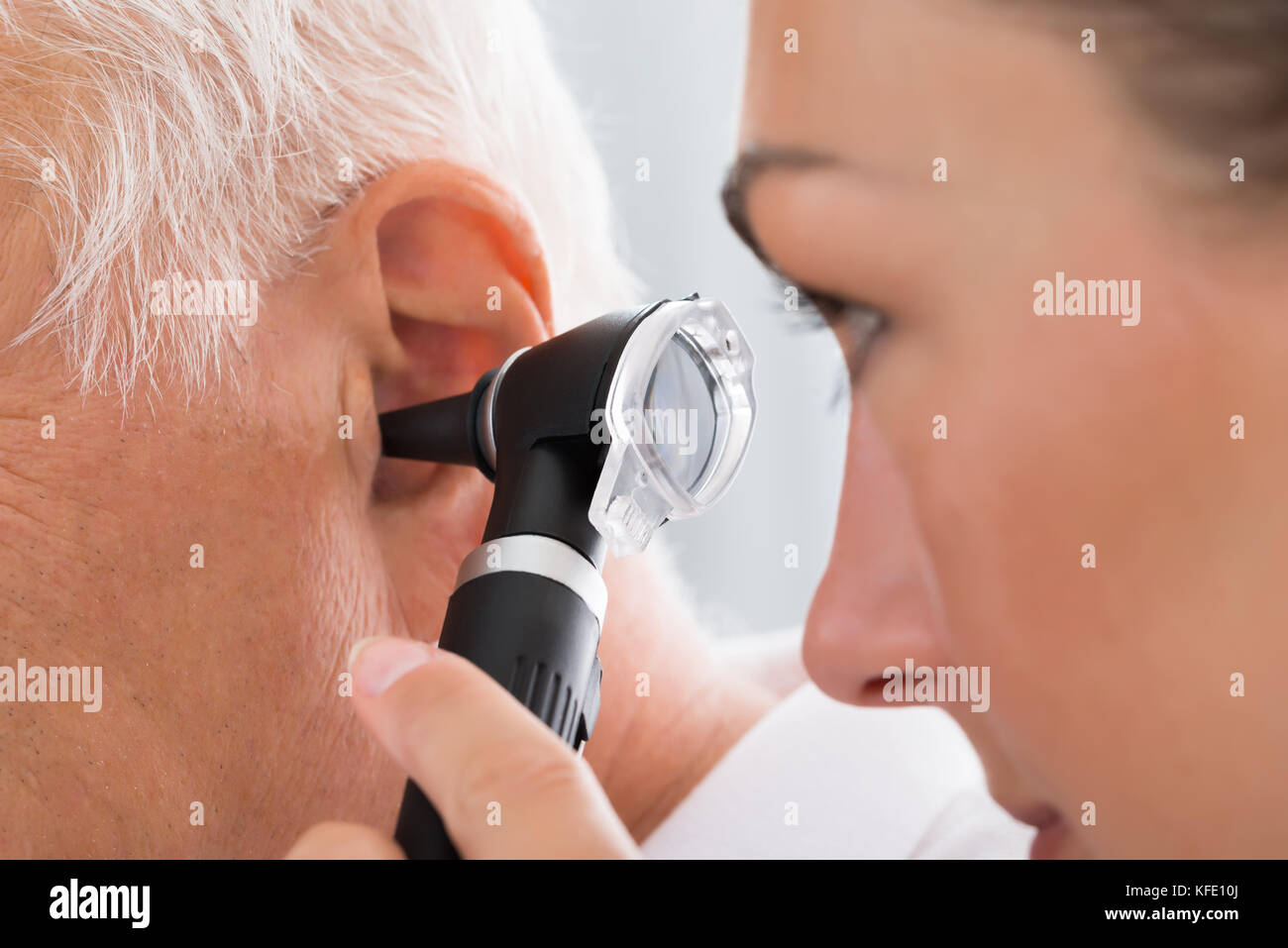 Close-up Of Female Doctor Examining Patient's Ear With Otoscope Stock ...