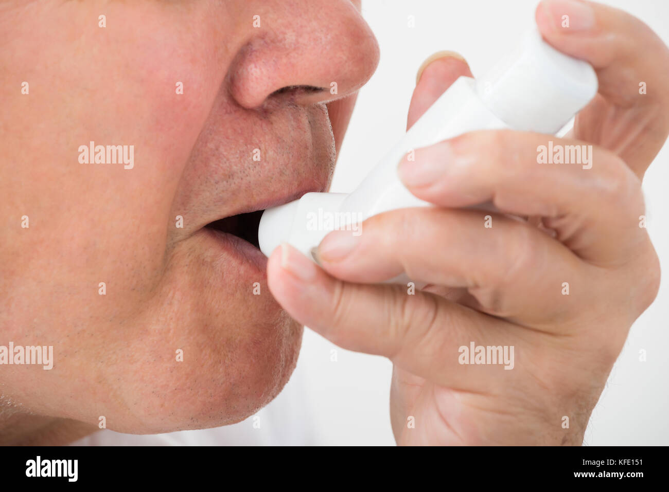 Close-up Of A Man Using Asthma Inhaler Stock Photo - Alamy