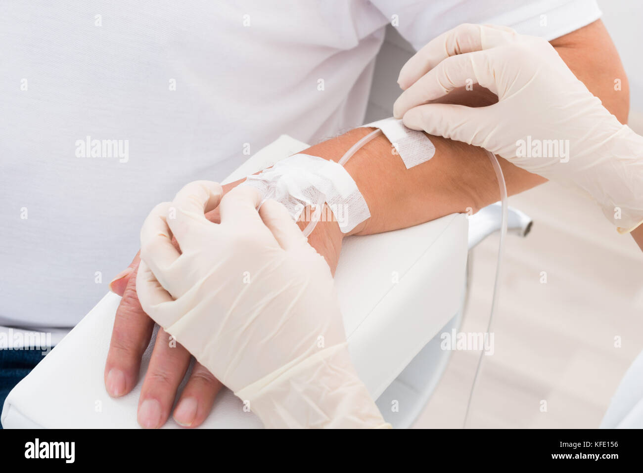 Close-up Of Doctor's Hand With Iv Drip Inserted In Patient's Hand Stock ...