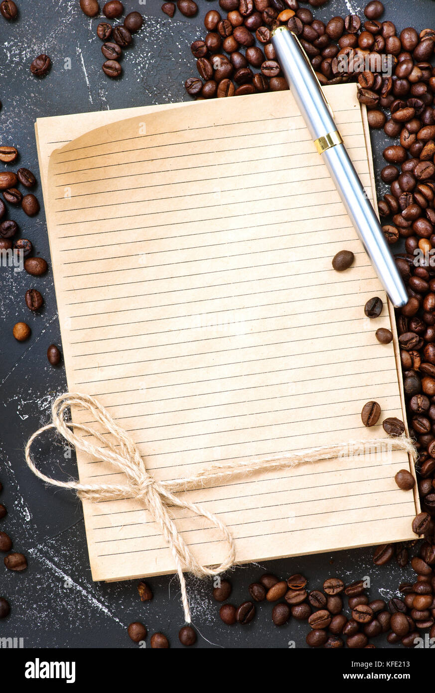 coffee beans and note on a table Stock Photo - Alamy