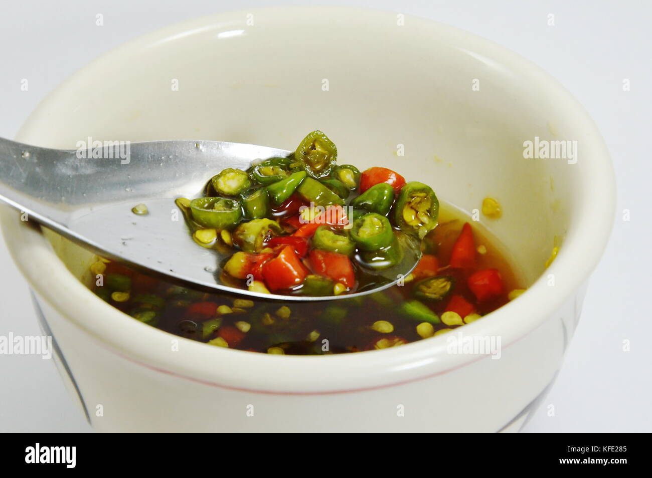 chop chili in fish sauce on cup Stock Photo - Alamy