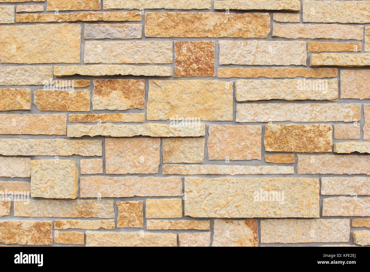 Modern Limestone (Kasota Stone) Brick Wall Background with Varying ...