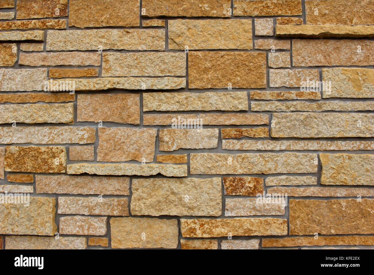 Modern Limestone (Kasota Stone) Brick Wall Background with Varying ...