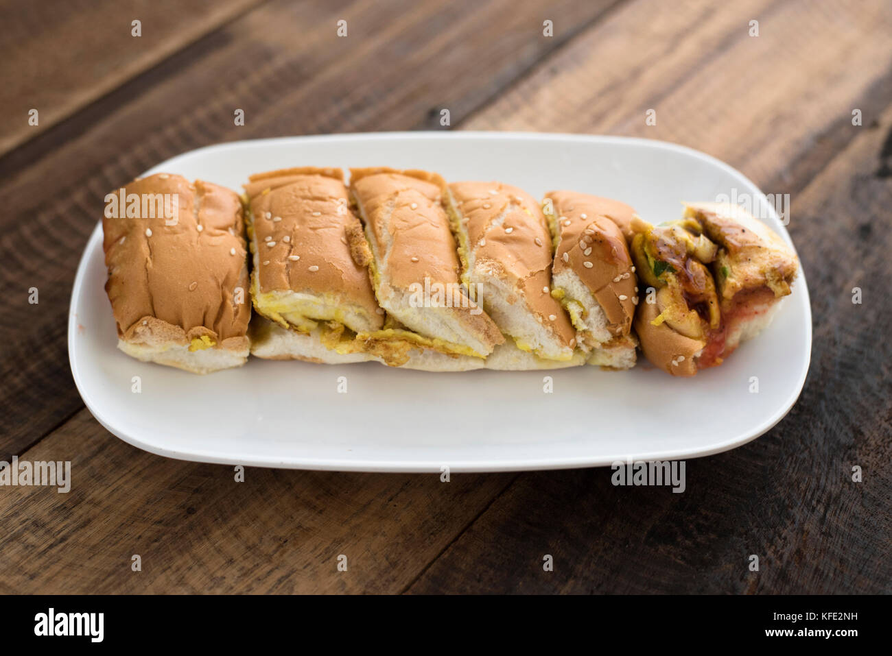 Malaysian delicacies (roti john) - bread with omelette in a plate on a ...