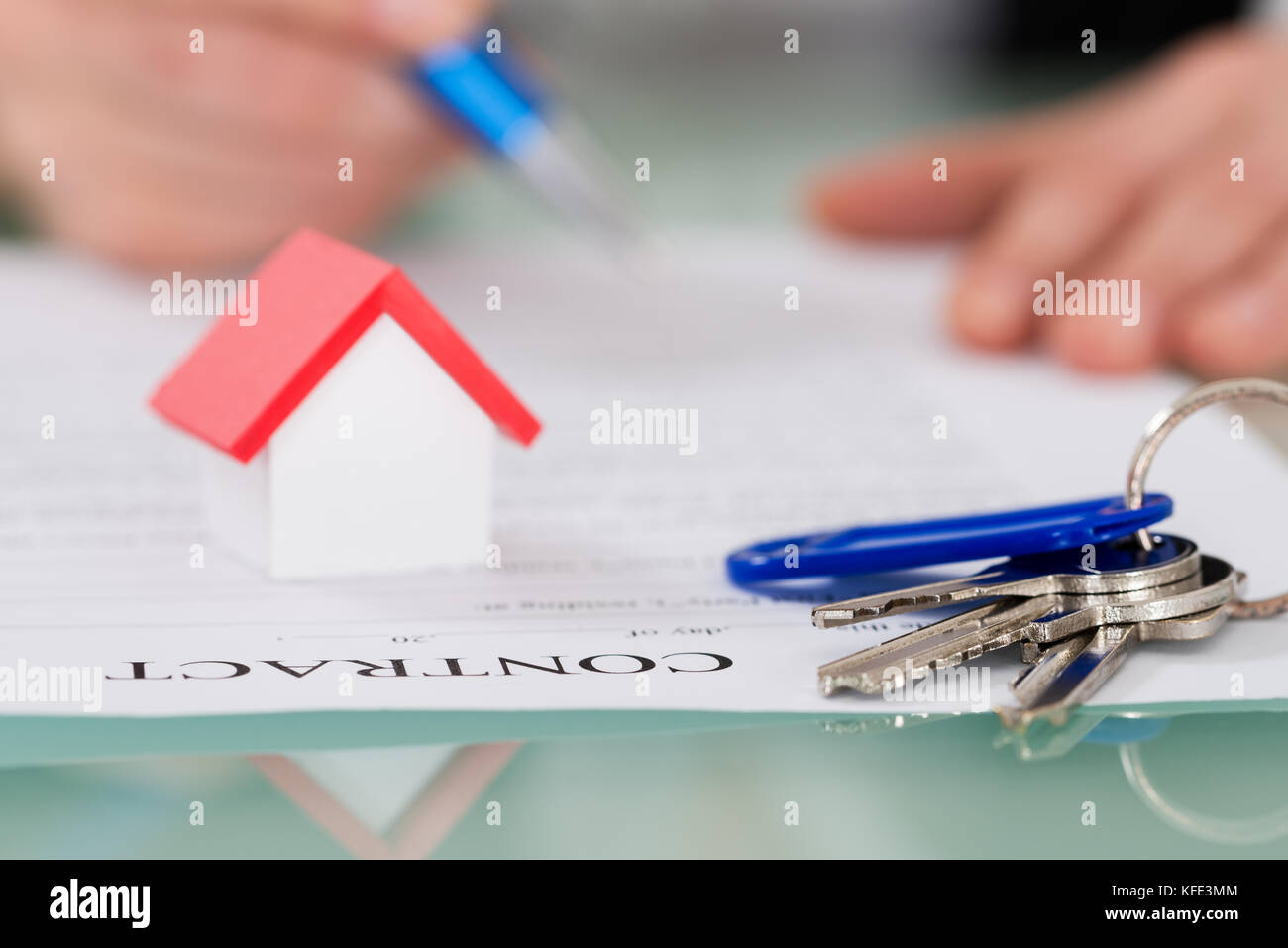 Close-up Of Contract With Key And House Model On Desk Stock Photo - Alamy