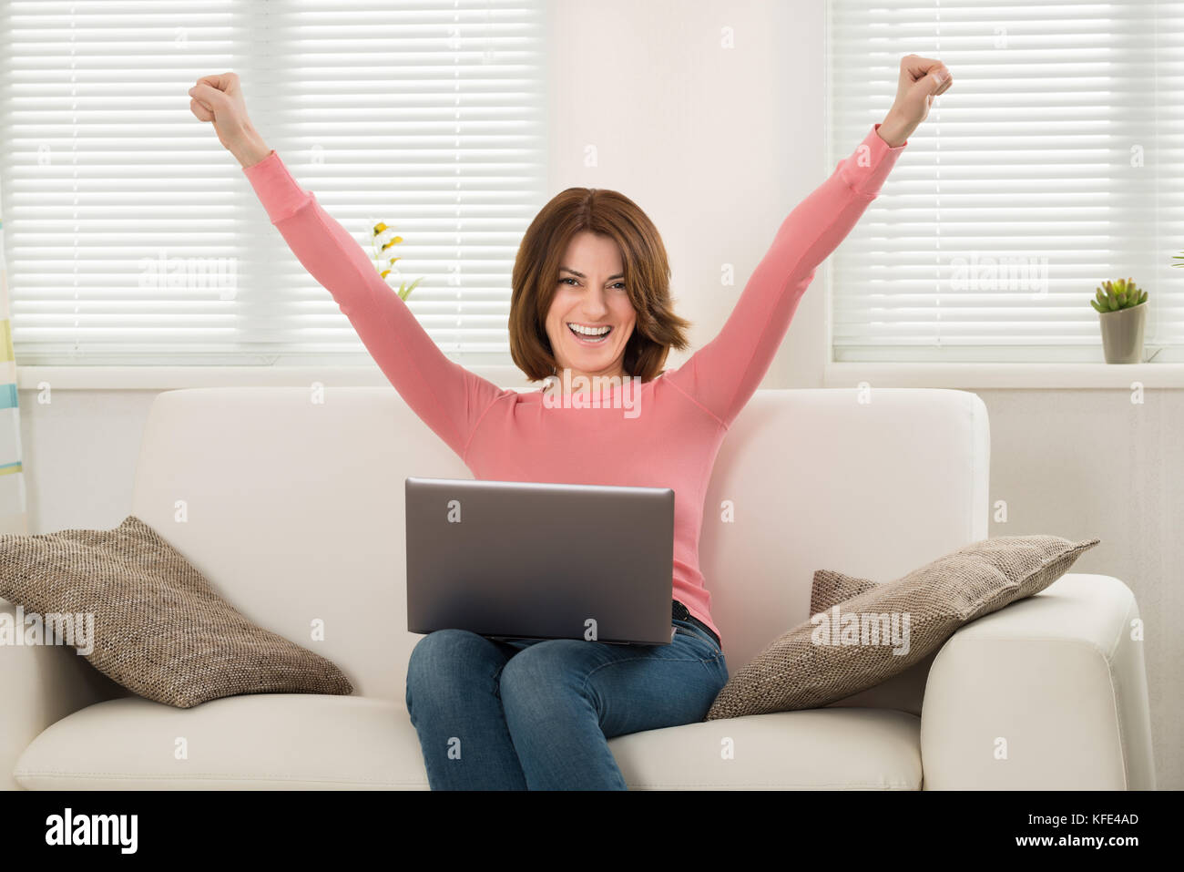 Excited woman computer home hi-res stock photography and images - Alamy