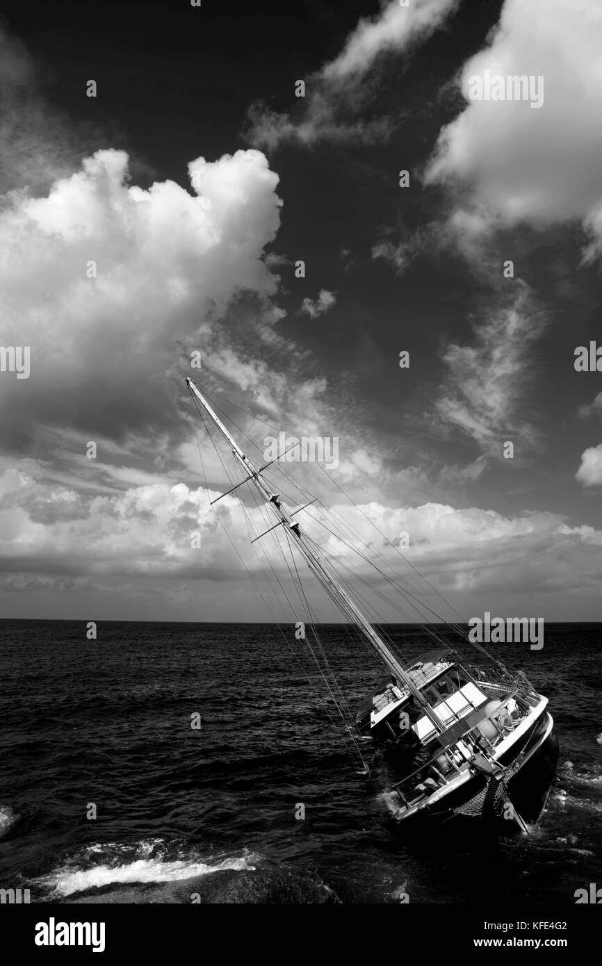 Schooner shipwrecked and beached on coastline rocks Stock Photo - Alamy