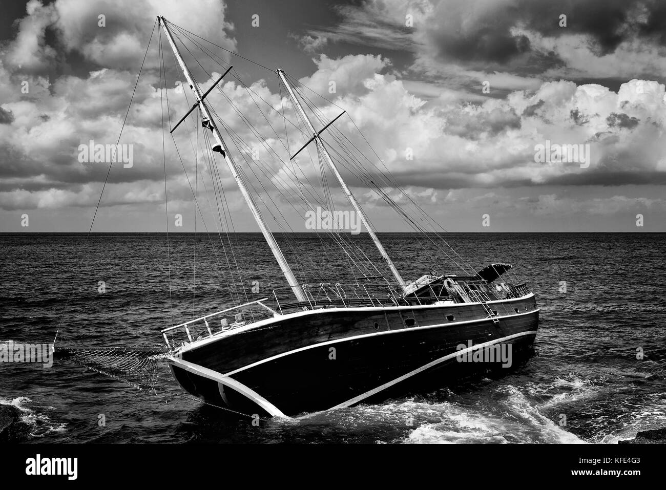 Schooner shipwrecked and beached on coastline rocks Stock Photo - Alamy