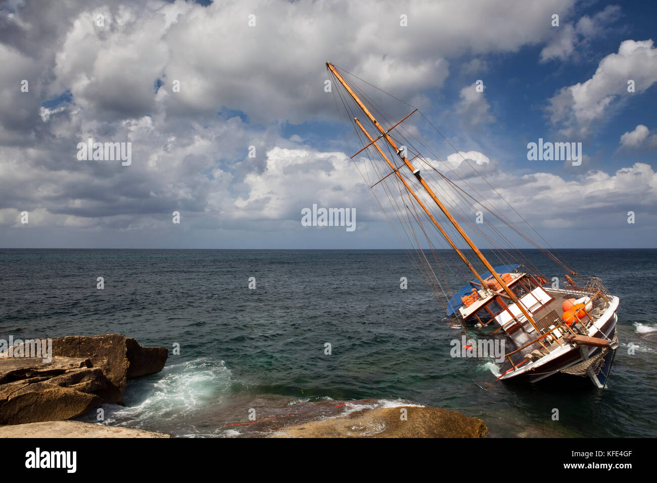 Schooner shipwrecked and beached on coastline rocks Stock Photo - Alamy