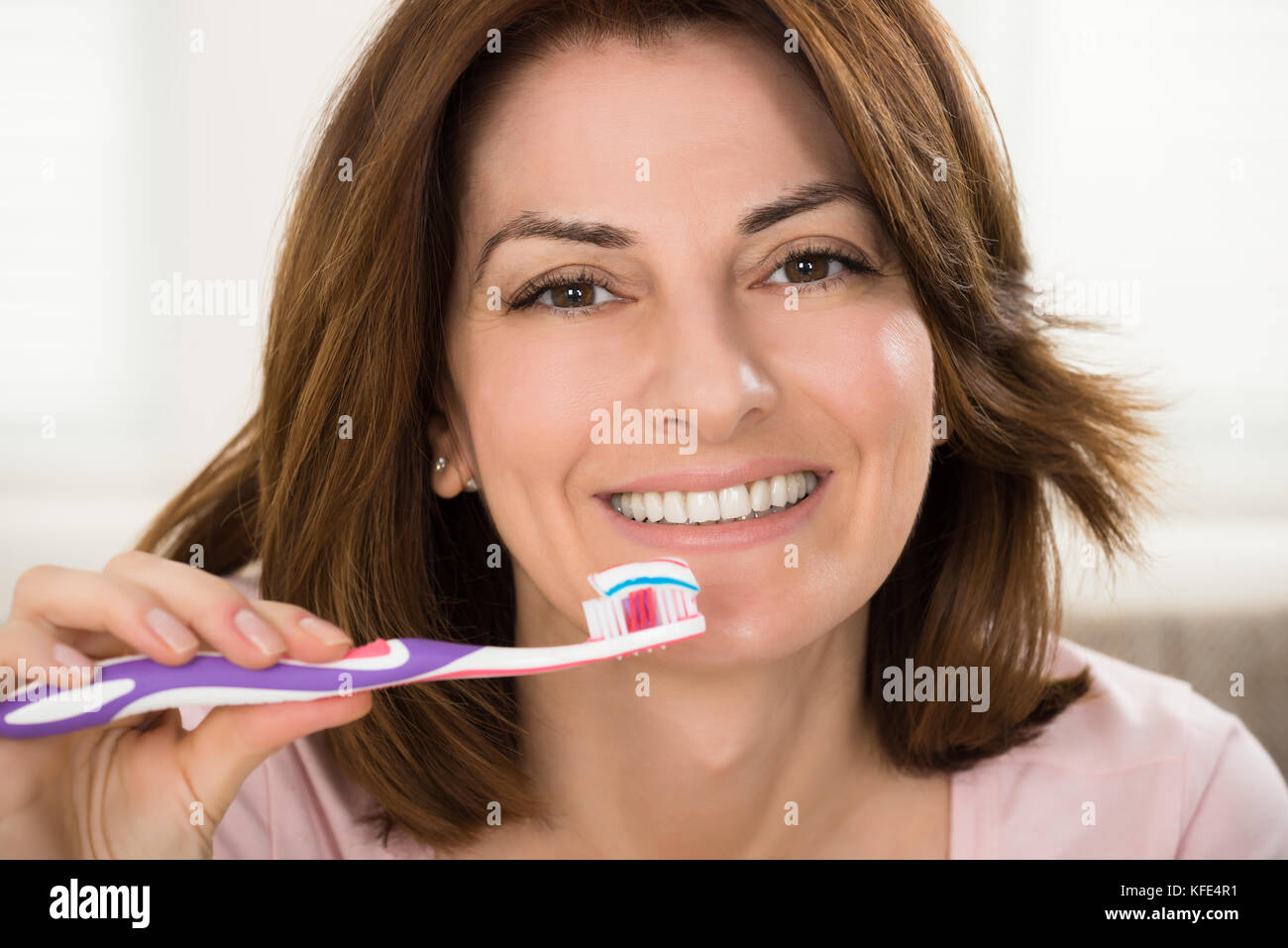 Close-up Of A Smiling Woman With Toothbrush And Toothpaste Stock Photo ...