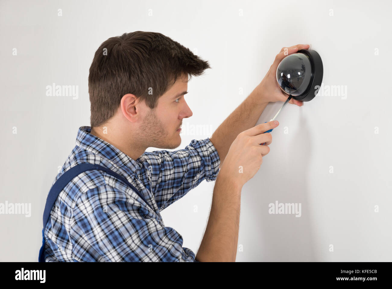 Young Male Technician Installing Surveillance Camera On Wall Stock ...