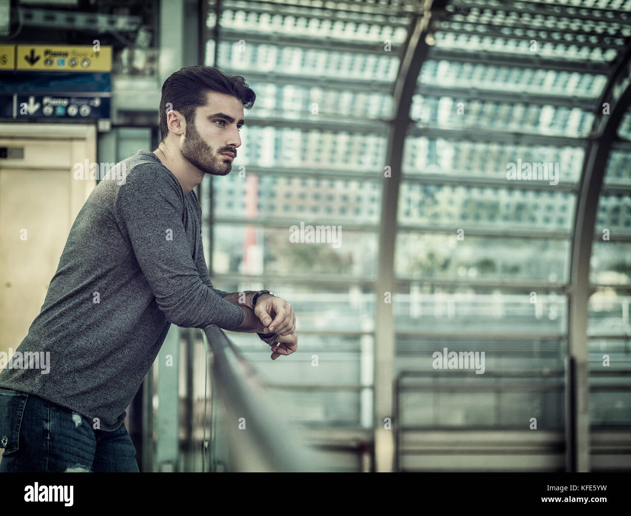 Handsome young man in modern building Stock Photo - Alamy