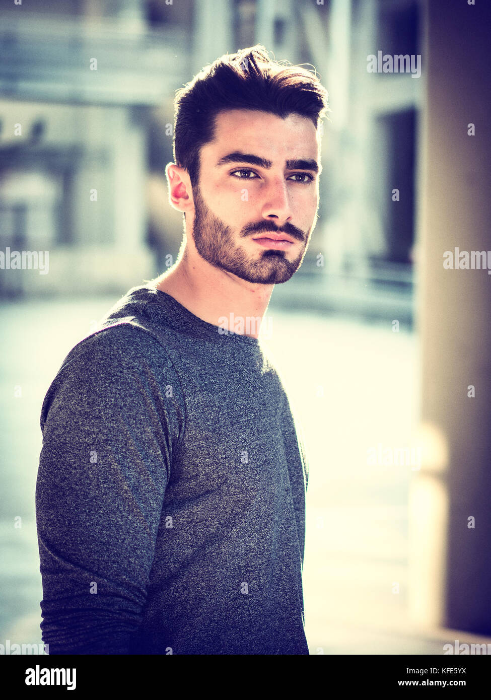 Handsome young man in modern building Stock Photo - Alamy