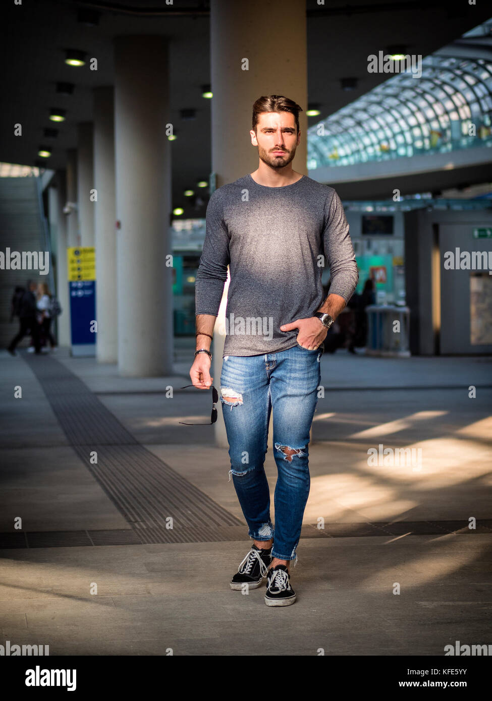 Handsome young man in modern building Stock Photo - Alamy