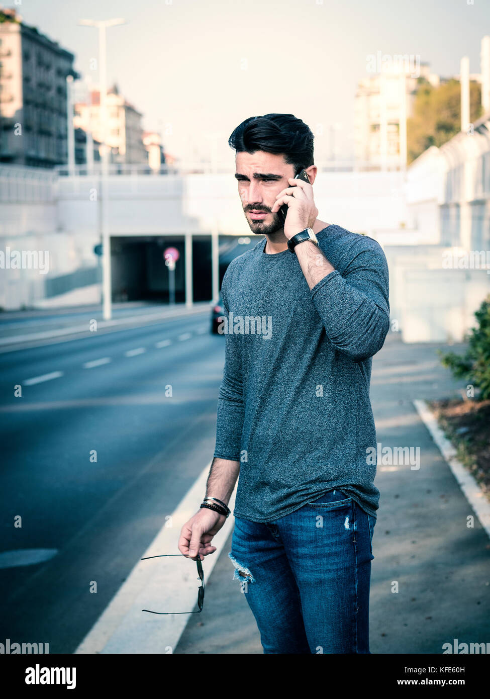 Handsome man making a phone call Stock Photo - Alamy