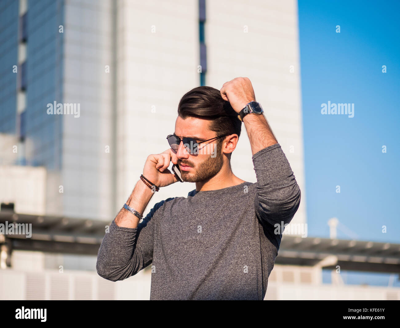 Handsome man making a phone call Stock Photo - Alamy