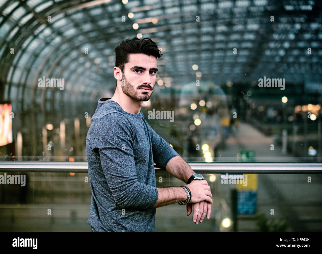 Handsome young man in modern building Stock Photo - Alamy