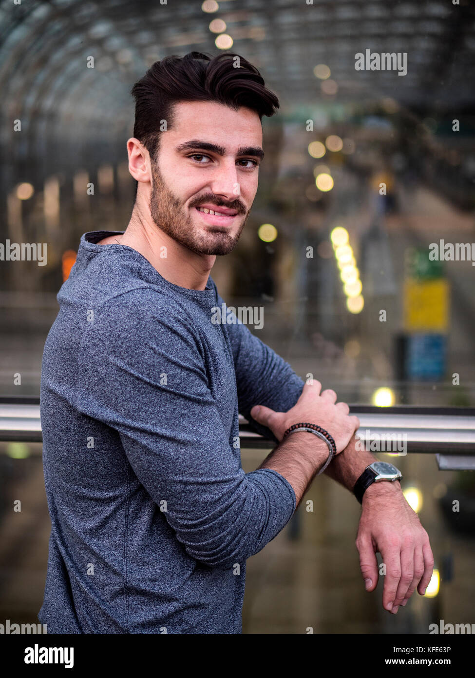 Handsome young man in modern building Stock Photo - Alamy