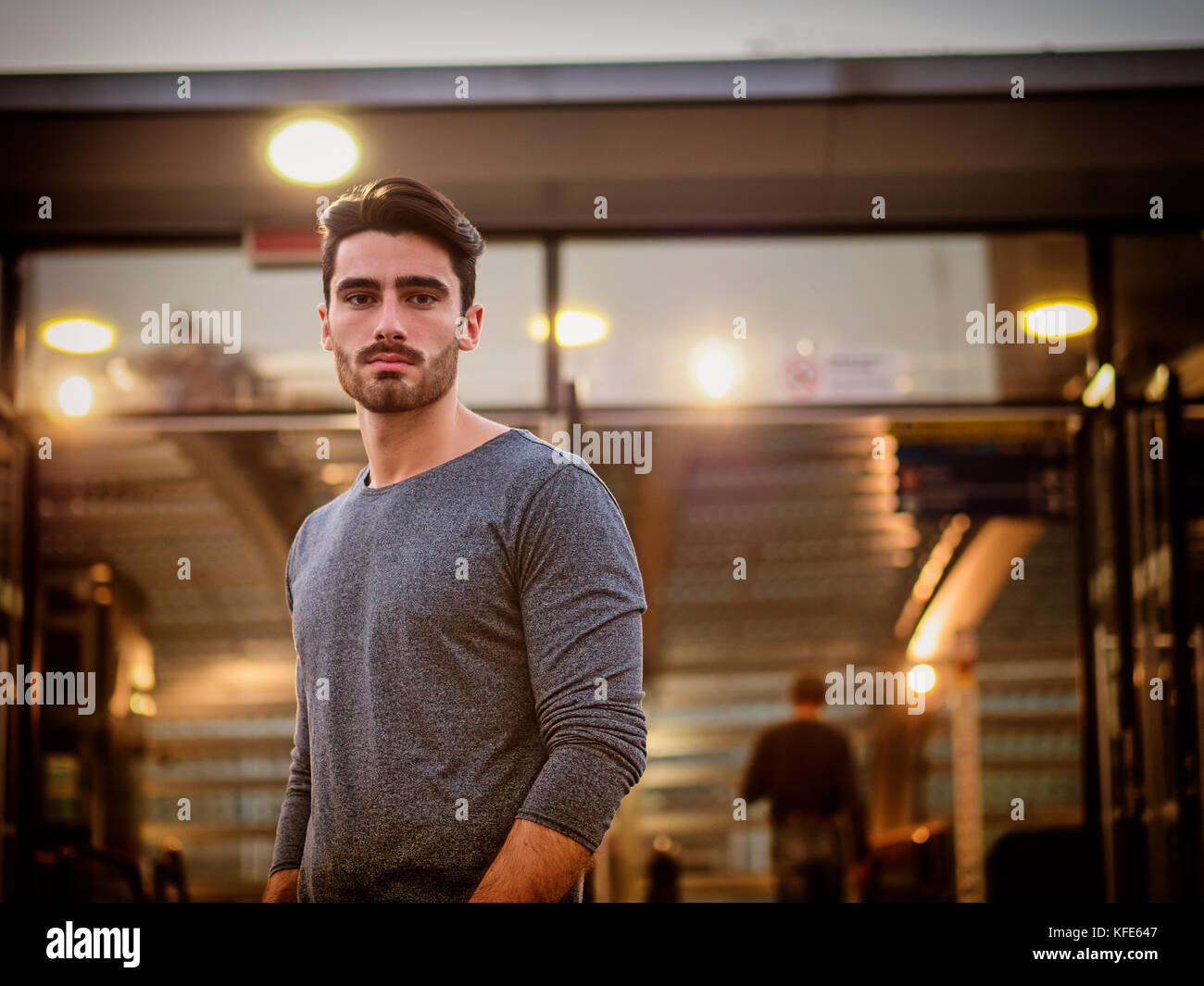 Handsome young man in modern building Stock Photo - Alamy