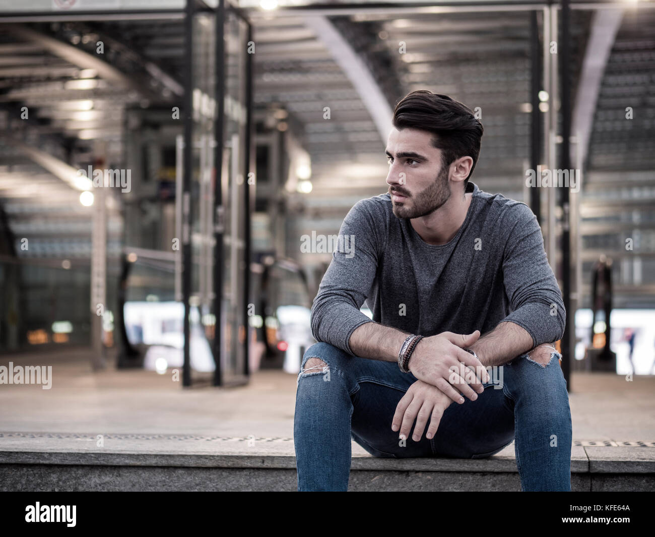 Attractive young man portrait at night with city lights Stock Photo - Alamy