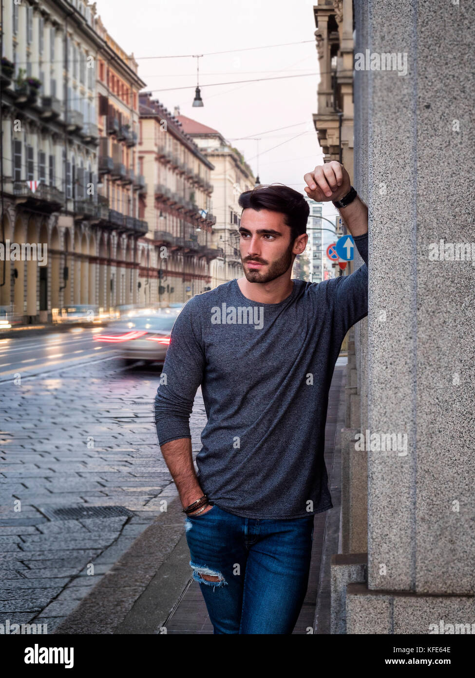 Attractive young man portrait at night with city lights Stock Photo - Alamy