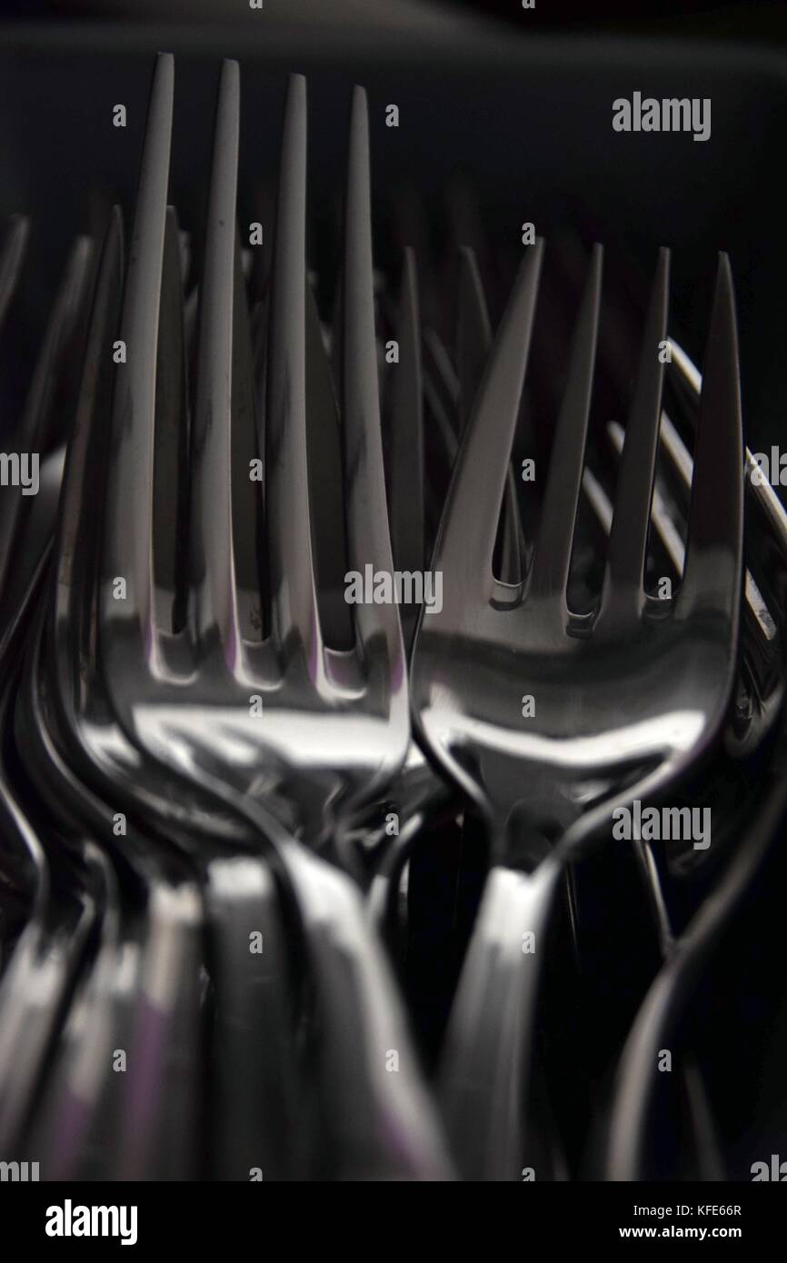 forks in black and white, abstract stacked forks in a cutlery rack ...