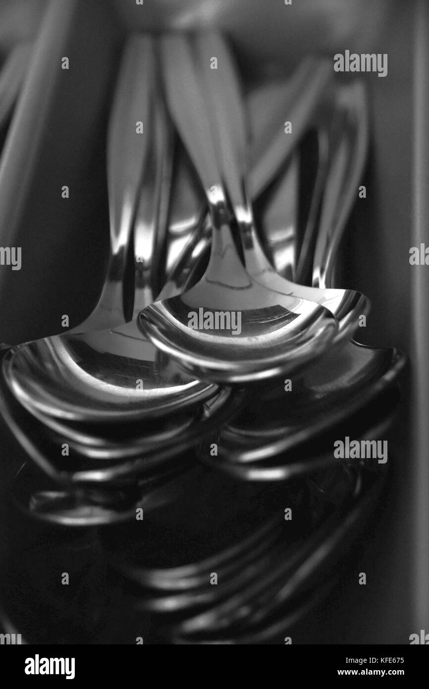 spoons in black and white, abstract stacked spoons in a cutlery rack ...