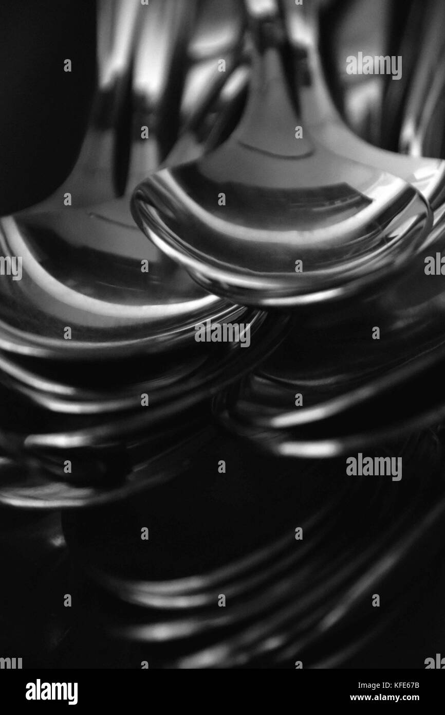 spoons in black and white, abstract stacked spoons in a cutlery rack ...